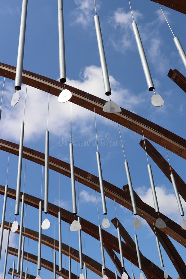 Metal Wind Chime Sculpture Against Sky, Three Rows Stock Image - Image ...