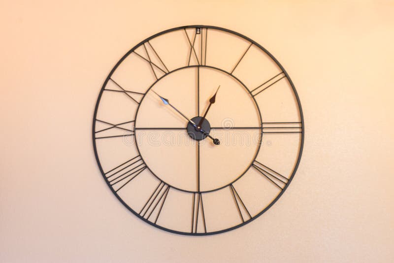 Metal Wire Clock Hanging on Orange Wall Stock Photo - Image of brown ...