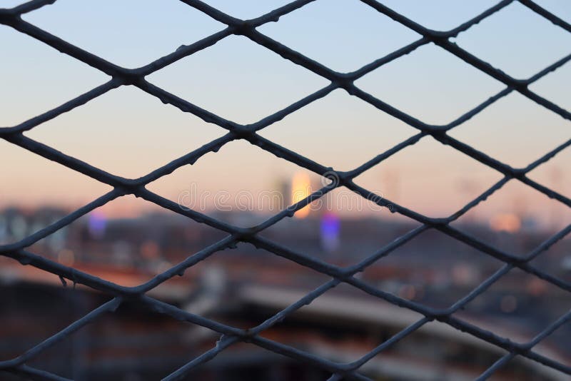 Metal Wire Fence in Front of City View Stock Photo - Image of blure ...
