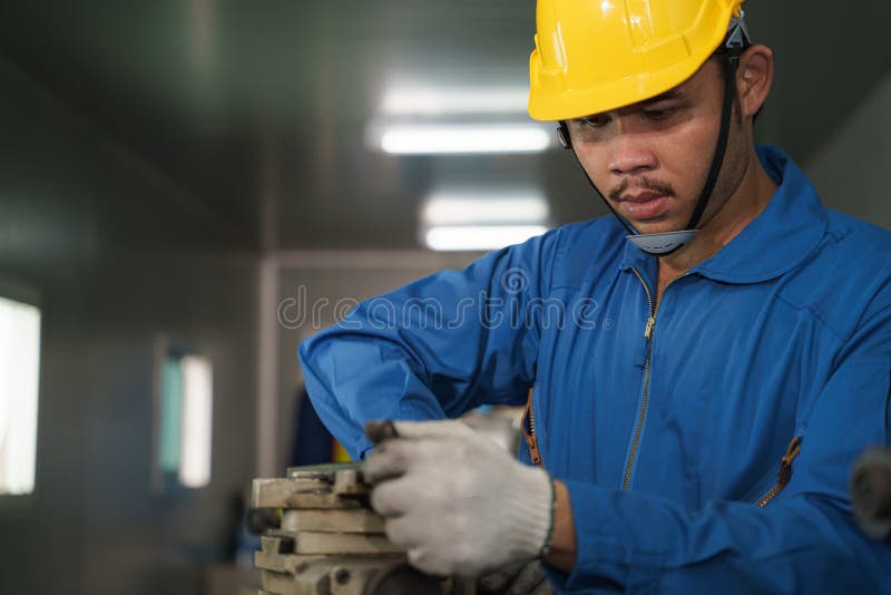 Metal Work Factory Worker Working with Lathe Machine in Lathe Workshop ...