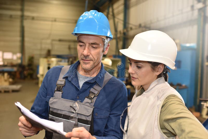 Metal Worker Explaining Young Apprentice Techniques Stock Image - Image ...