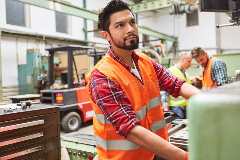 Metal Worker in Production Operates a Machine Stock Photo - Image of ...