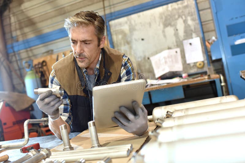 Metal Worker with Tablet at Workshop Stock Image - Image of industry ...