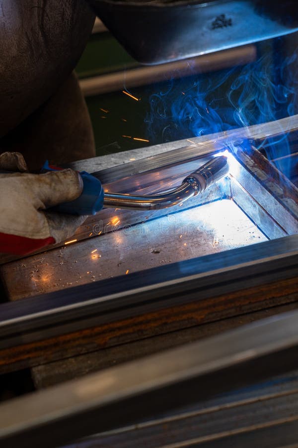 Metal Worker Welding and Fabricating a Metal Frame for a Garden Patio ...
