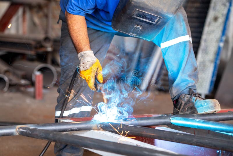 Metal Worker is Welding Metals with Protection of Him Self Stock Photo ...