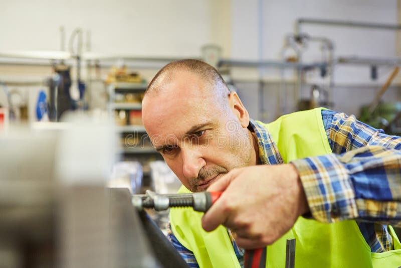 Metal Worker Works with Clamp on Workbench Stock Photo - Image of ...