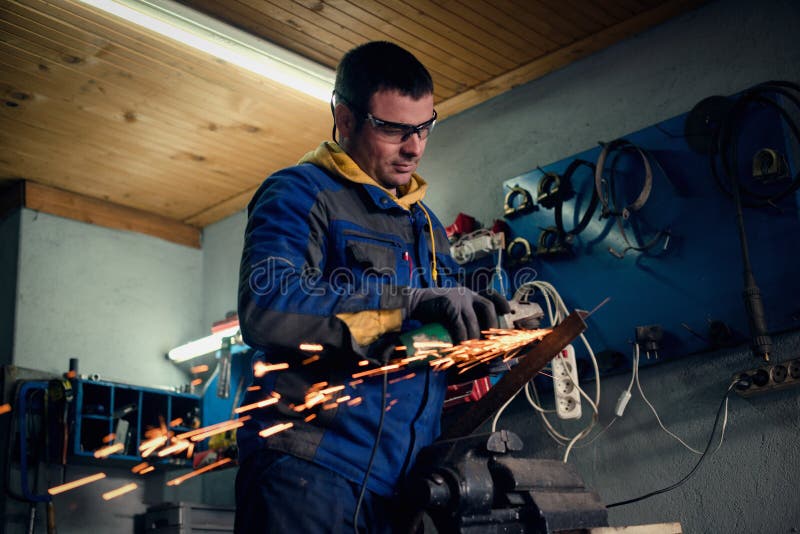Metal worker in workshop stock image. Image of expertise - 110283613
