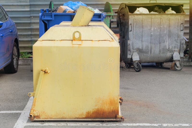 Metal Yellow Trash Can. Dumpsters Being Full with Garbage. Garbage ...