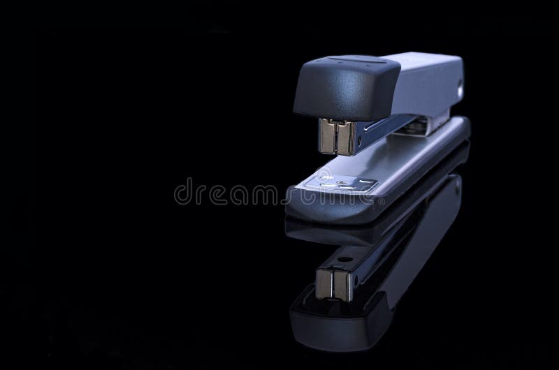 Metalic Stapler with Reflection on Black Background Stock Photo - Image ...