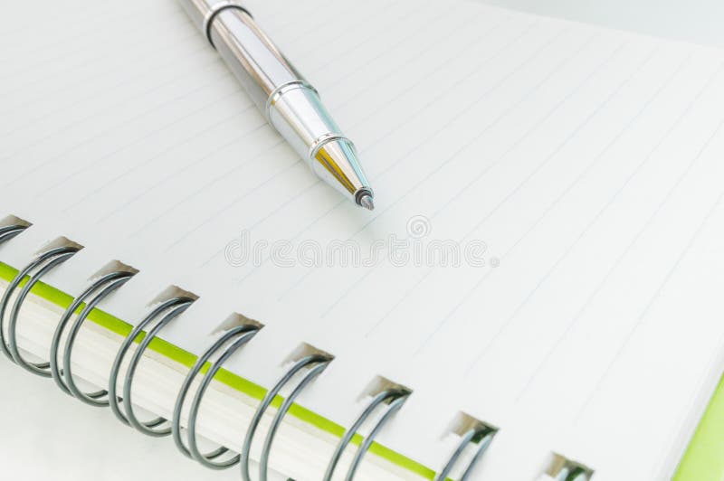Metallic Ball Pen on Notebook Stock Photo - Image of sign, spiral: 68556288