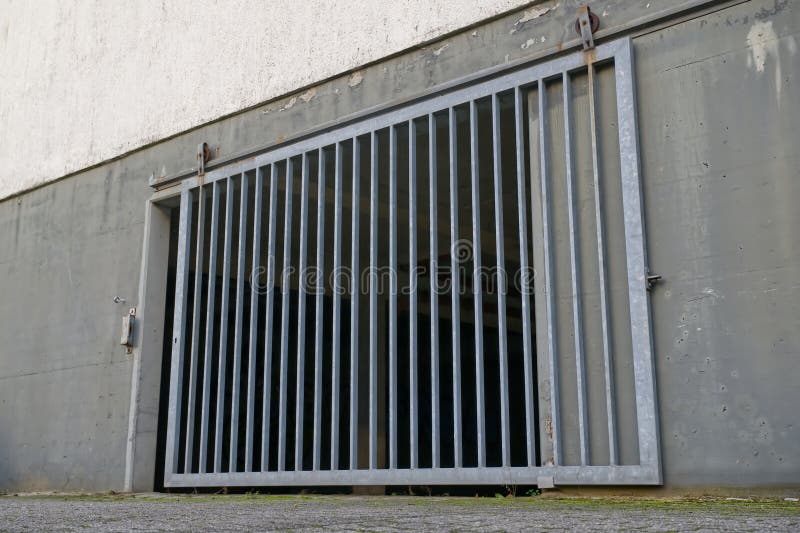 Metal Barred Gate Against Concrete Wall Stock Photo - Image of window ...