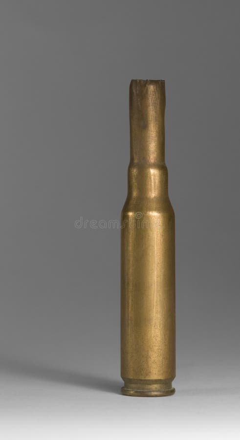 Metallic Bullet Casing in Grey Back Stock Photo - Image of clipping ...