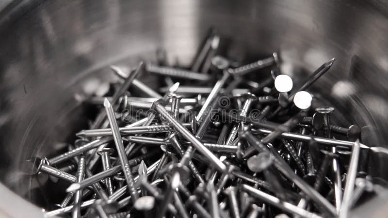 Metallic Carpenter Nails Falling in Steel Container. Slow Motion Stock ...