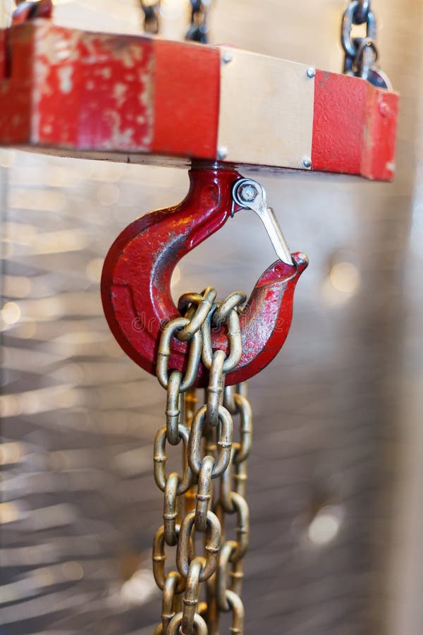 Metallic Chain Handle with Red Hook in Technical Room. Crane Cargo Hook ...