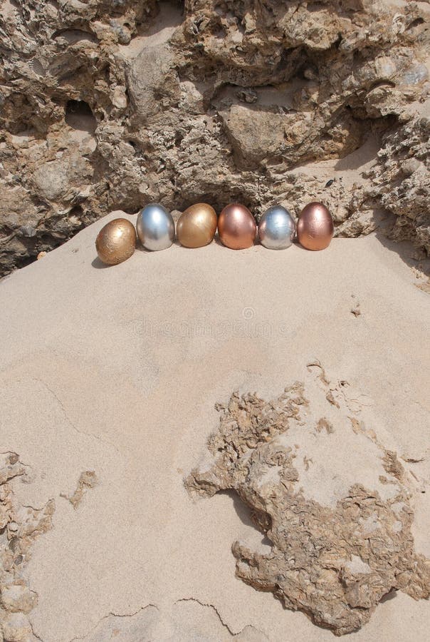 Metallic Easter Eggs on a Cliff Stock Photo - Image of rocks, metallic ...
