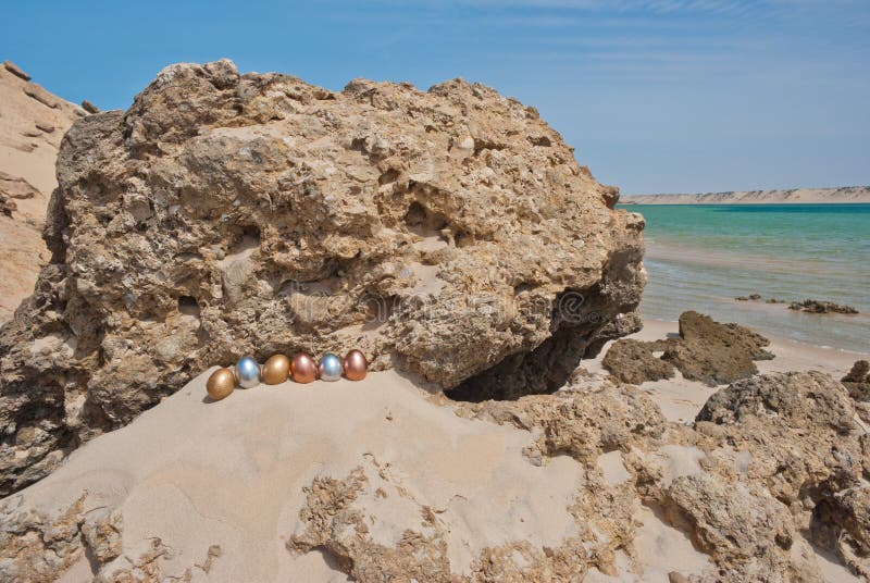 Metallic Easter Eggs on a Cliff Stock Image - Image of season ...