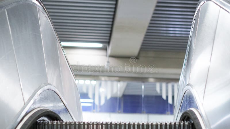 Metallic Escalator in a Subway Station, Focus on Moving Steps and Lines ...