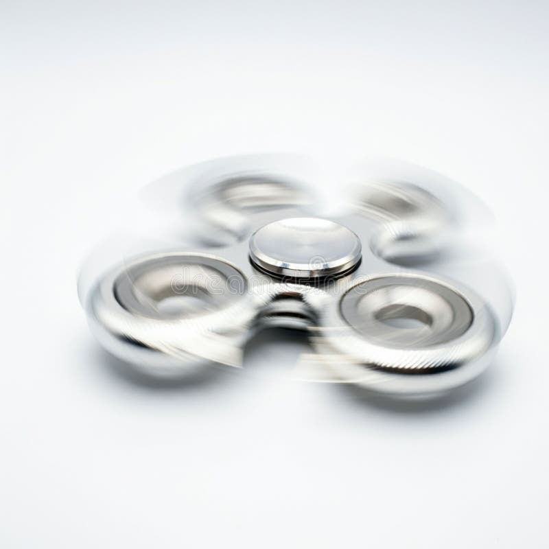 A Metallic Fidget Spinner Captured in Motion, Creating a Blurred Effect ...