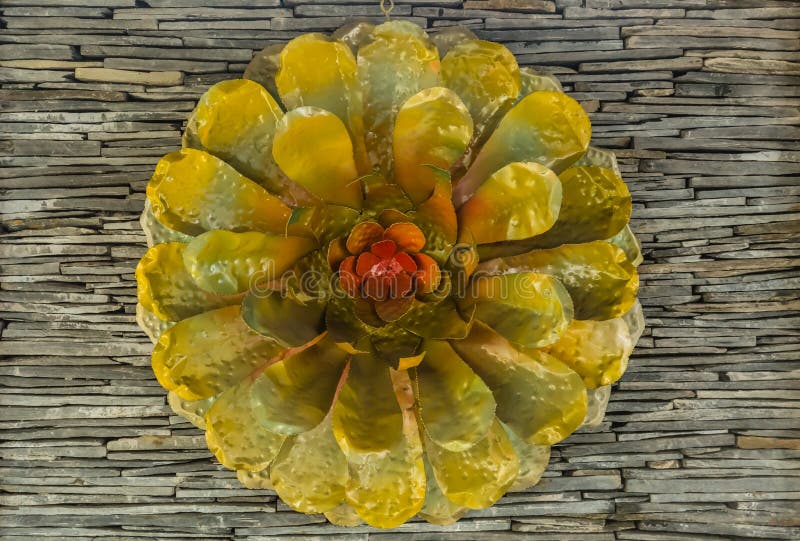 Golden Color Metallic Flower on the Stone Wall Background Stock Photo ...