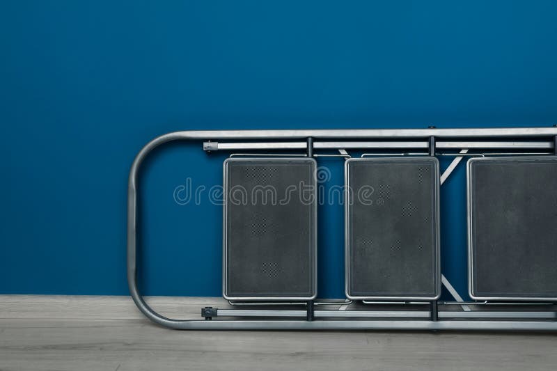 Metallic Folding Ladder Near Blue Wall Indoors Stock Image - Image of ...