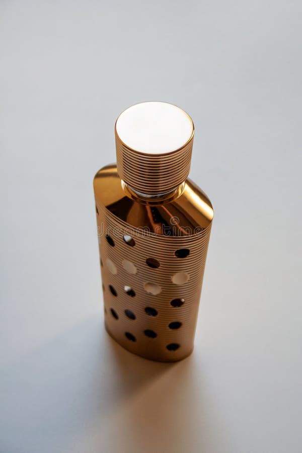 Metallic Gold Perfume Bottle Container in Art Deco Style Stock Photo ...