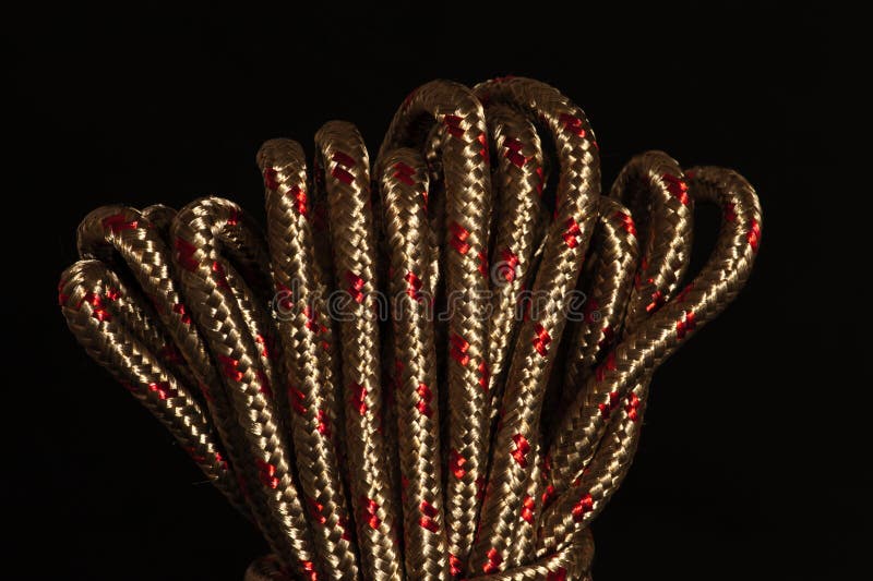 Metallic gold and red rope stock image. Image of transparent - 189230985