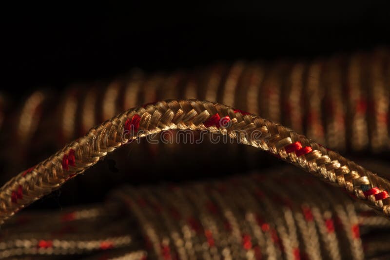 Metallic gold and red rope stock image. Image of soft - 189231111