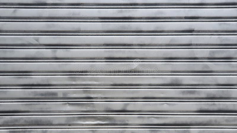 Metallic Grey Rolling Door with Striped Front Pattern. Old White Zinc ...