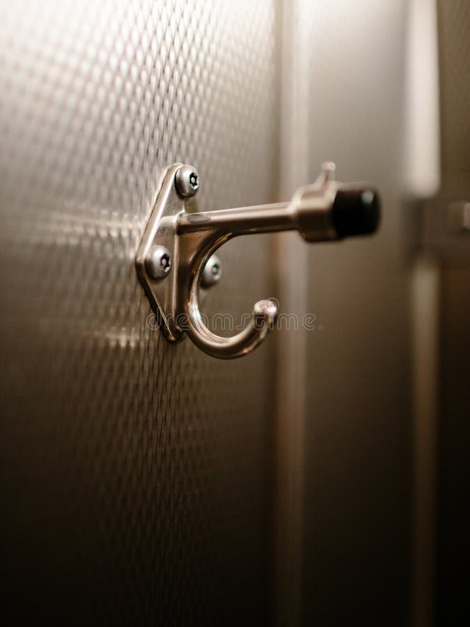 Metallic Hanger on a Metallic Wall Stock Photo - Image of focus ...