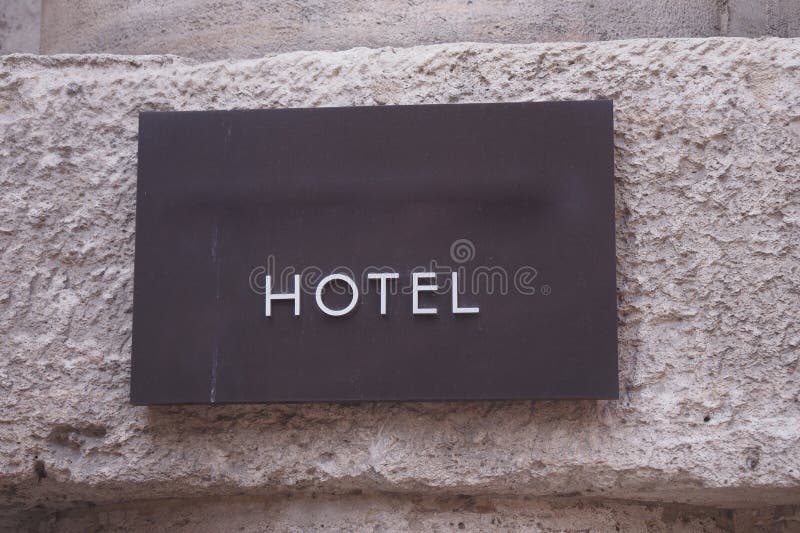 The Metallic Hotel Sign on the Wall Stock Image - Image of outdoors ...