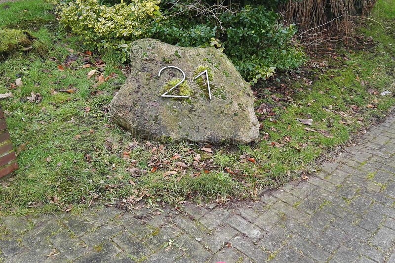 A Metallic House Number 21 on a Stone at the Gate Entrance Stock Photo ...
