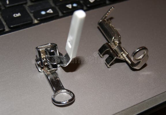 Metallic Key Tools for Securing Electronic Devices at a Workspace Stock ...