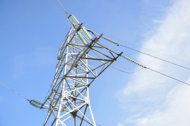 Metallic Pylon of High-voltage Power Lines Against Blue Sky with Clouds ...