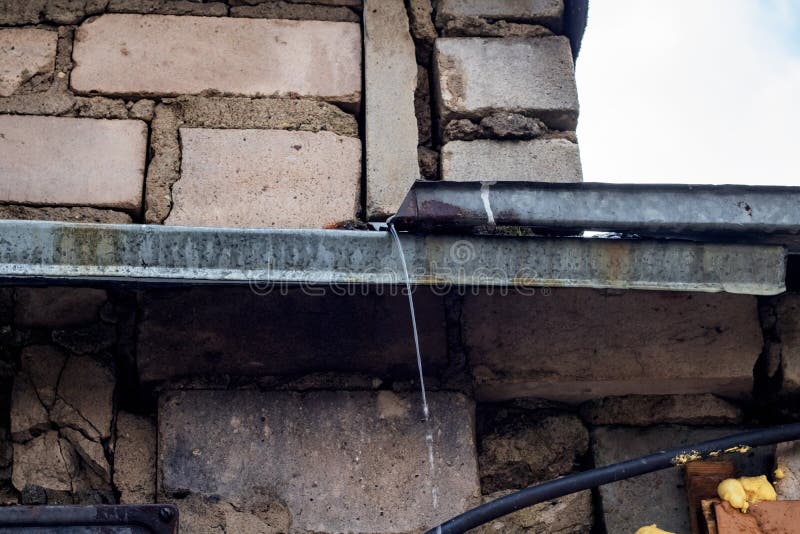 Metallic Rainwater Drain on the Brick Wall Stock Image - Image of pipe ...