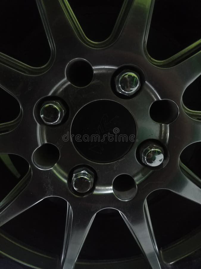 A Metallic Silver Car Wheel Taken from a Parallel Angle Stock Image ...