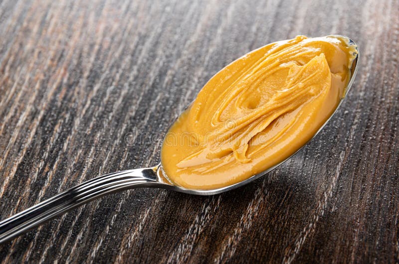 Spoon with Peanut Butter on Wooden Table Stock Photo - Image of bowl ...