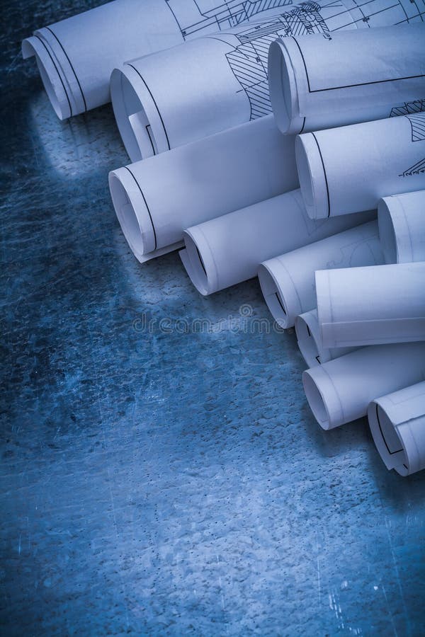 Metallic Surface with Variety of Rolled Up White Stock Image - Image of ...