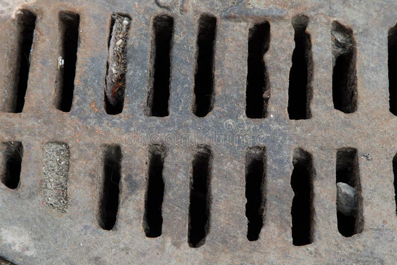 Metallic Textures on Sewer Manhole Stock Photo - Image of drains ...