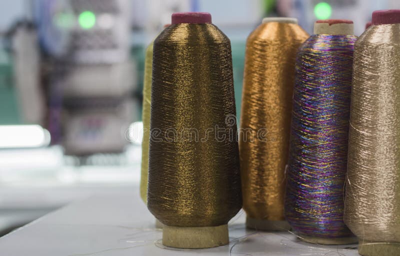 Metallic Threads of Gold Shades in Front of the Embroidery Machine ...