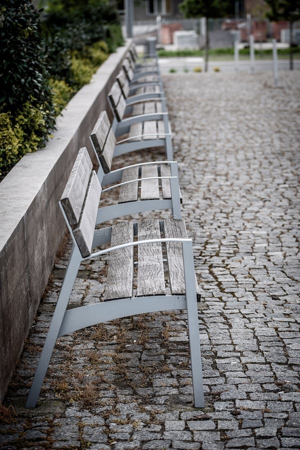 Metallic and wooden bench stock image. Image of street - 70464067