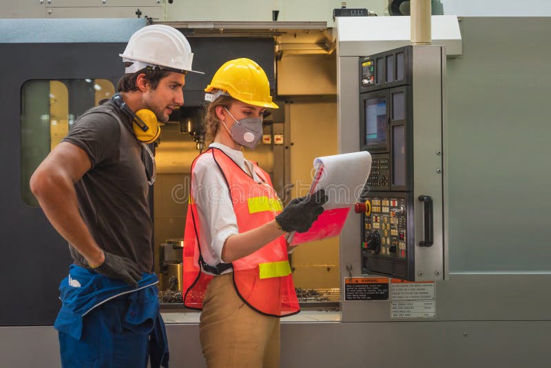 Machine Control Worker at Control Panel Operating CNC Lathe Machine in ...