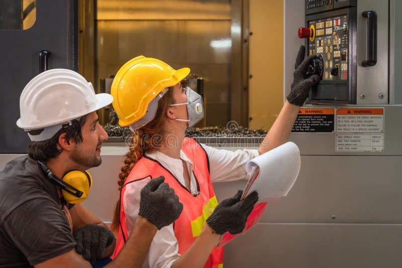 Industrial or Factory Engineering Worker and Supervisor Setting Up ...