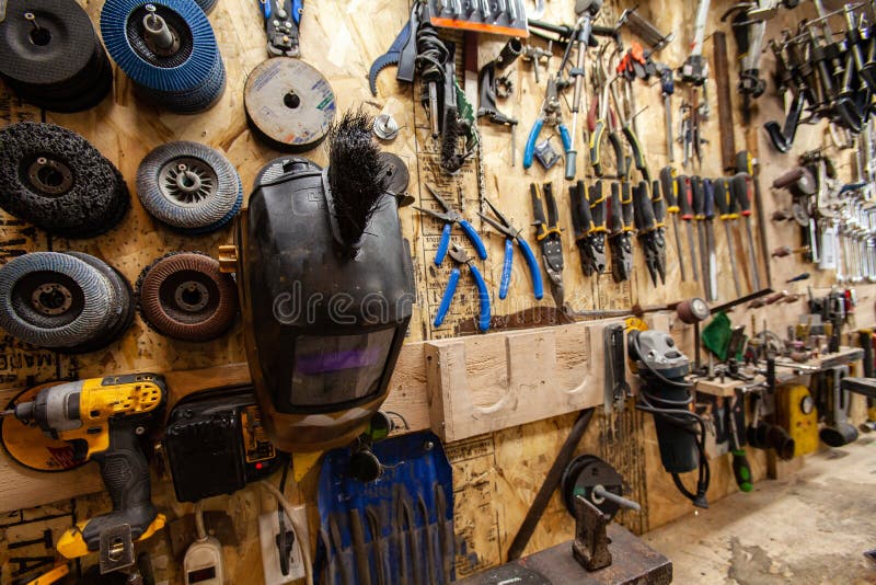 Metalwork Tools Hang on Wall in Workshop Stock Photo - Image of objects ...