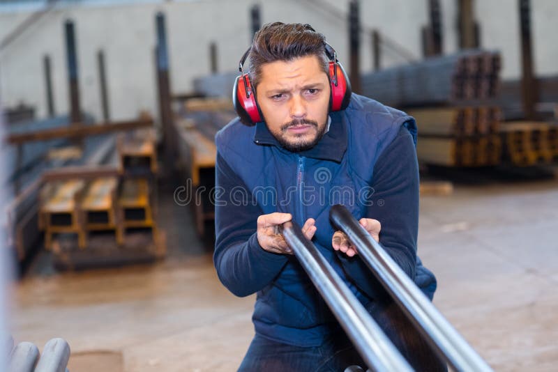 Metalworker Controls Metal Bars in Steel Mill Stock Photo - Image of ...
