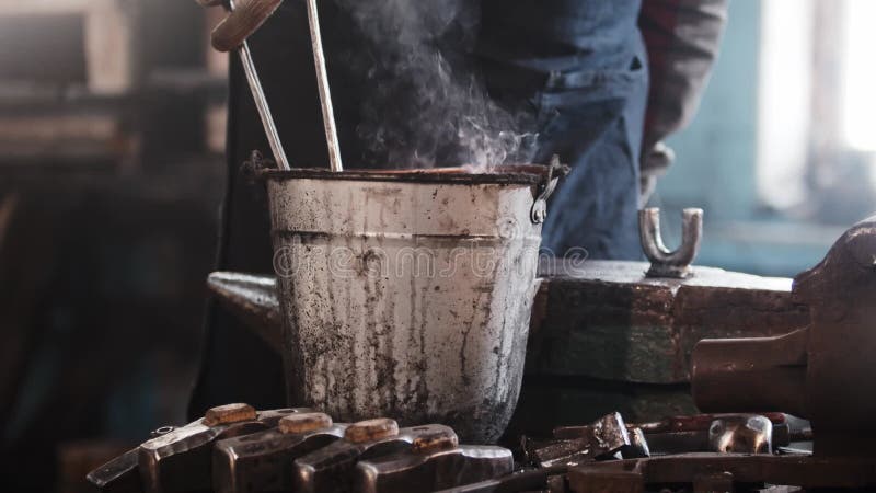 Blacksmith Cooling Metal in Forge Stock Footage - Video of smoke, anvil ...