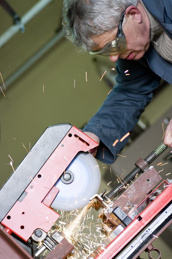 Man in metal workshop stock photo. Image of cutting, cutter - 4778778