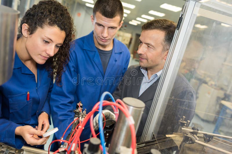 Metalworker with Training People Using Electronic Machine Stock Image ...