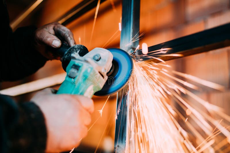 Metalworker Using Disc Grinder for Cutting Metal in Construction ...