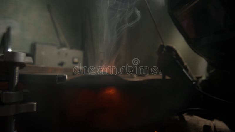 Metalworker Using Welding Machine on Iron Surface. Man Worker Welding ...