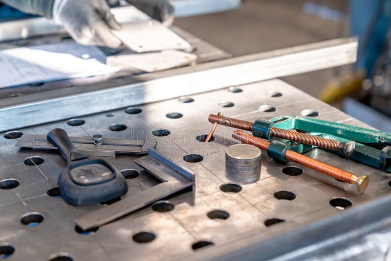 Metalworker Using Welding Table with Clamps and Measuring Tools Stock ...